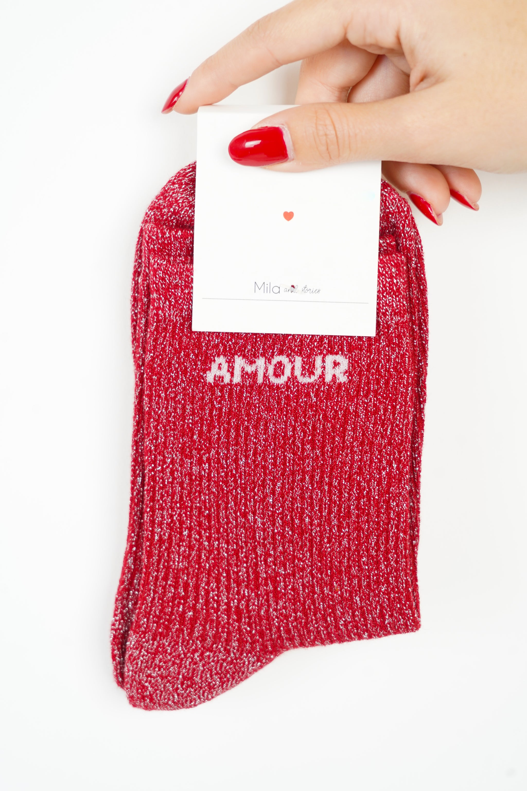 Chaussettes à paillettes rouges avec écriture "Amour"